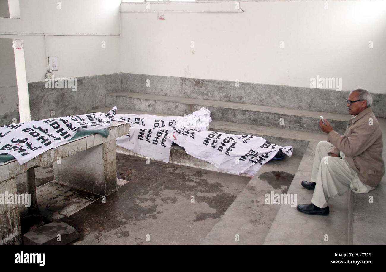 Man sitting with dead bodies of his beloveds who killed during road ...