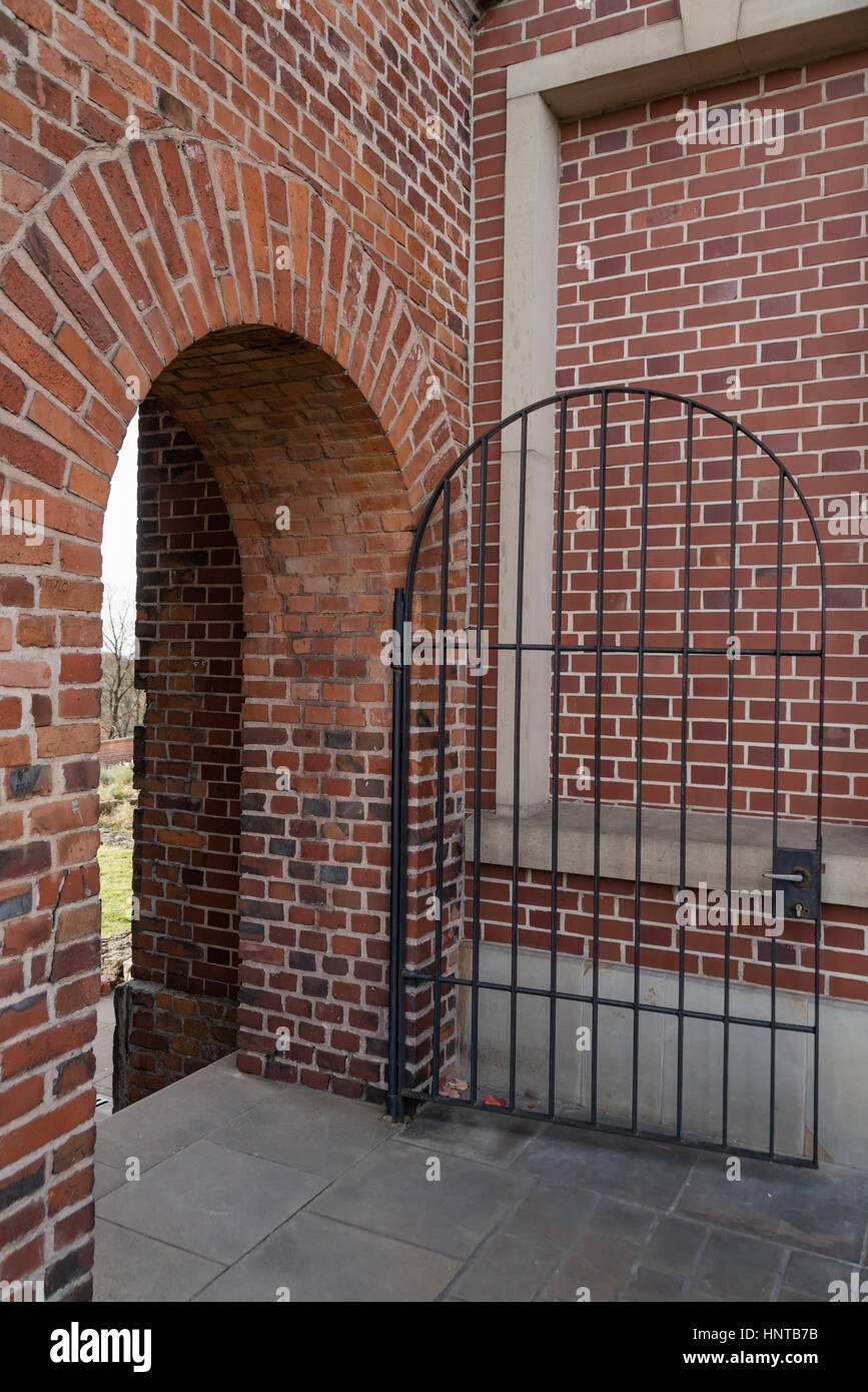 view of the masonry arch of brick with metal door Stock Photo - Alamy