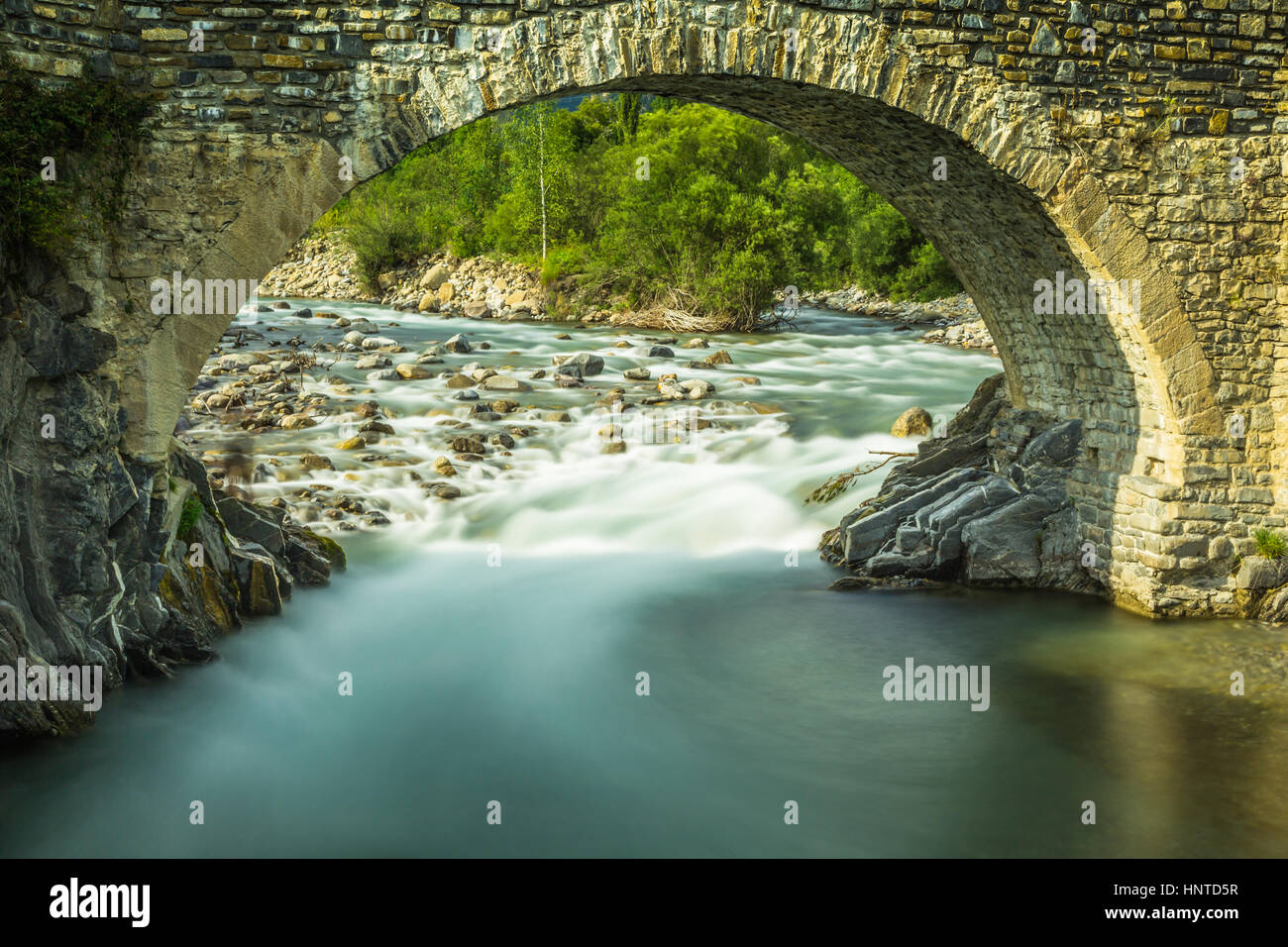 View of old stone bridge over river Stock Photo - Alamy