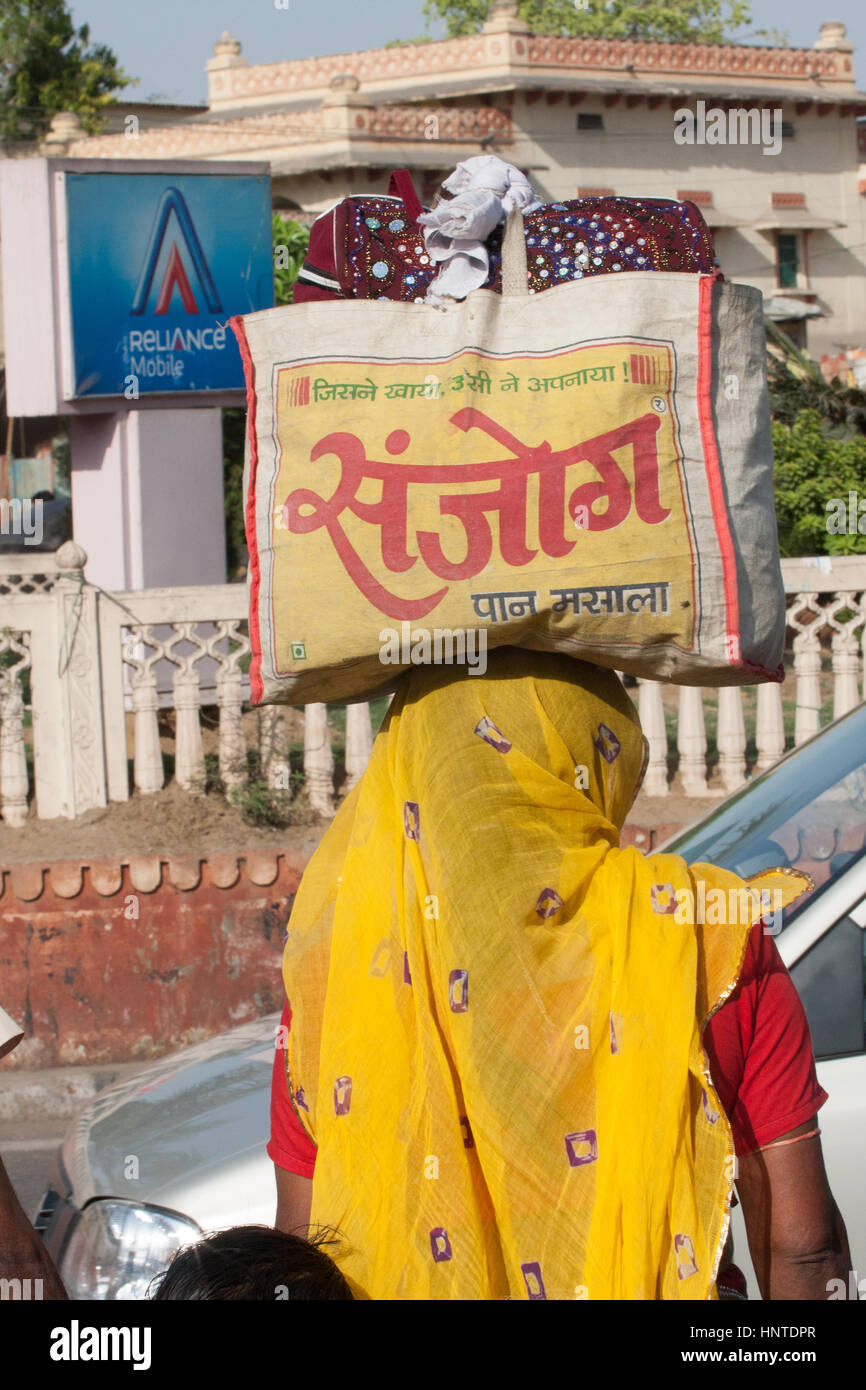 Indian woman carrying luggage on hi-res stock photography and images ...