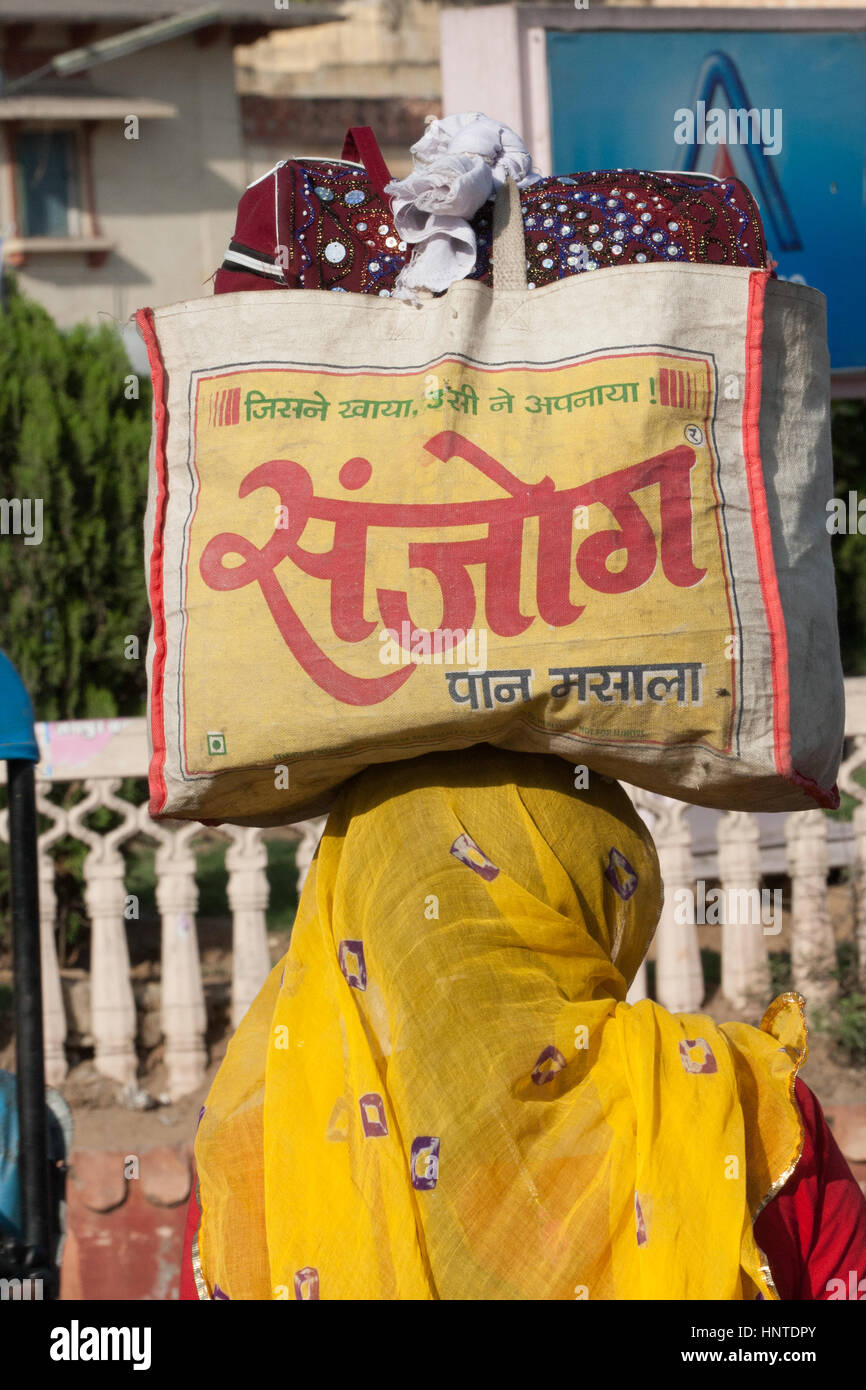 Indian woman carrying luggage on hi-res stock photography and images ...