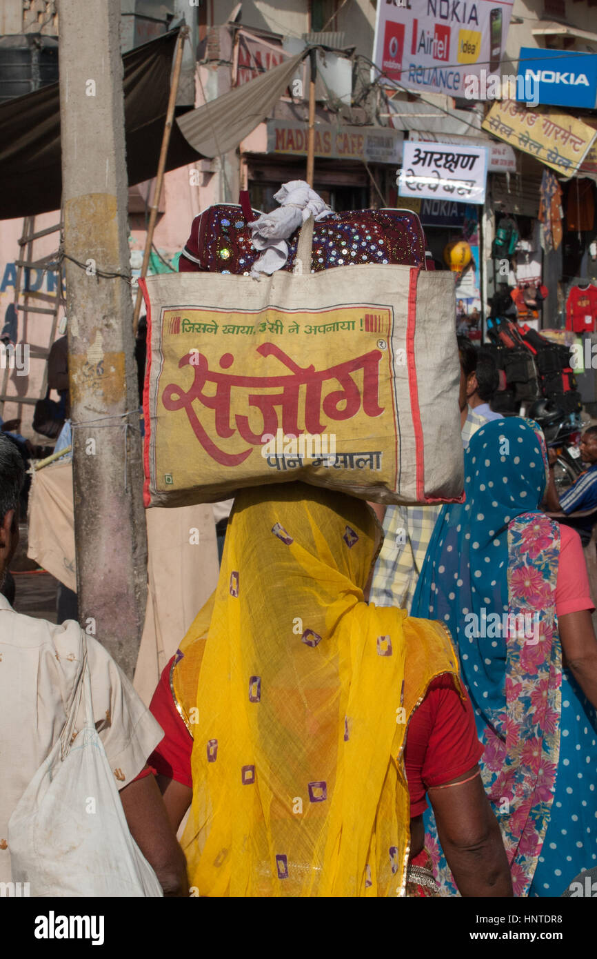 Indian woman carrying luggage on hi-res stock photography and images ...