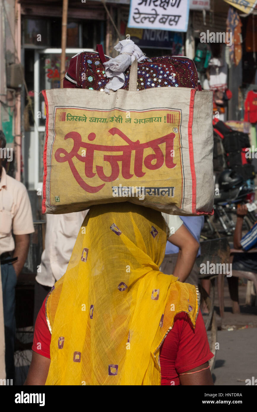Indian woman carrying luggage on hi-res stock photography and images ...