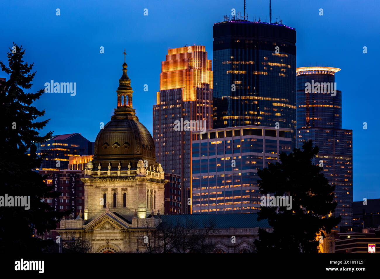 Minneapolis skyline at sunset with the Basilica, IDS Tower, Capella ...