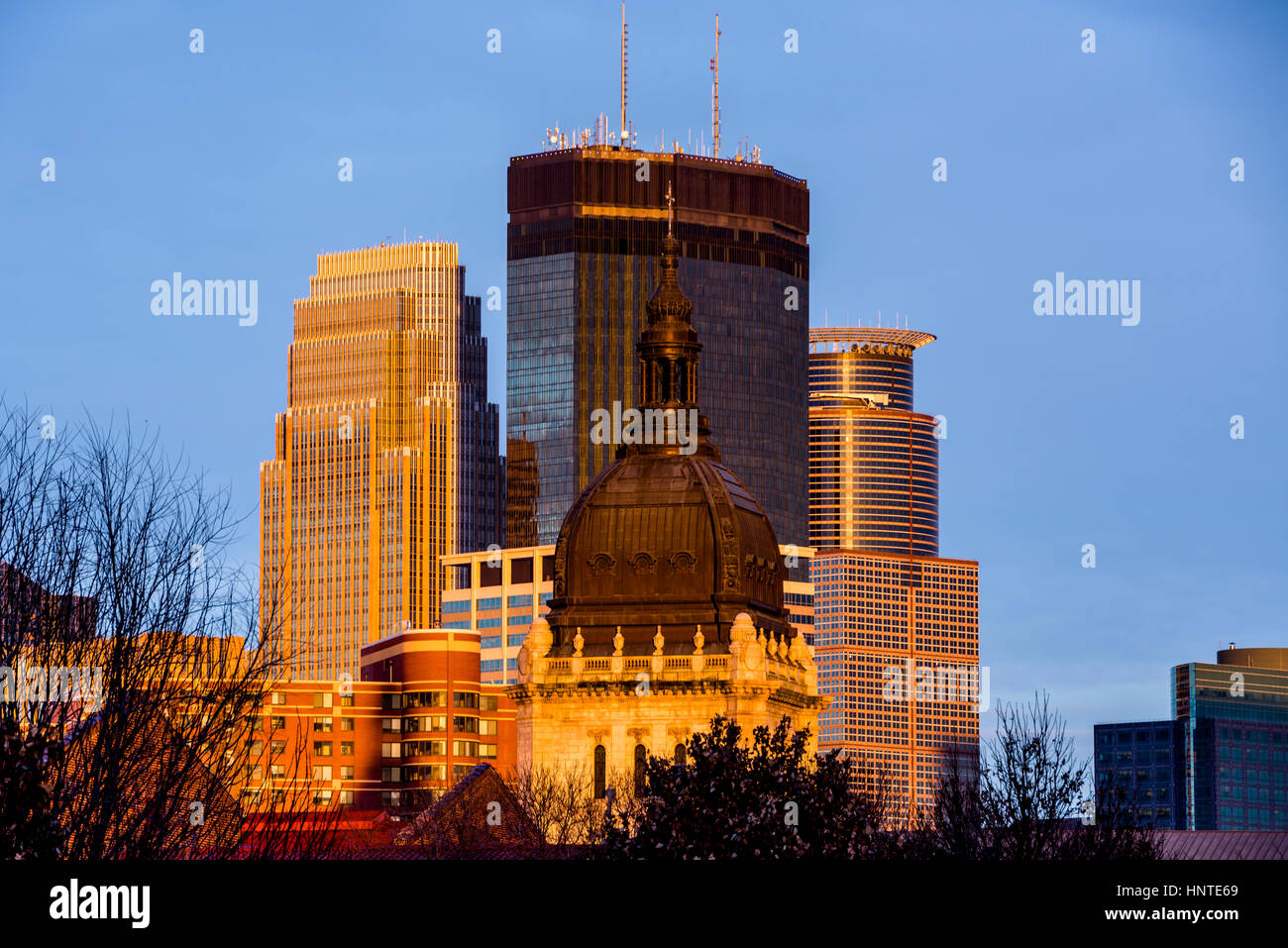 Minneapolis skyline at sunset with the Basilica, IDS Tower, Capella ...