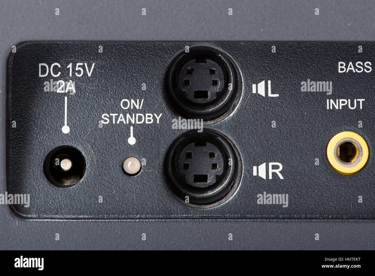 Inputs on the back of an old computer speaker Stock Photo - Alamy