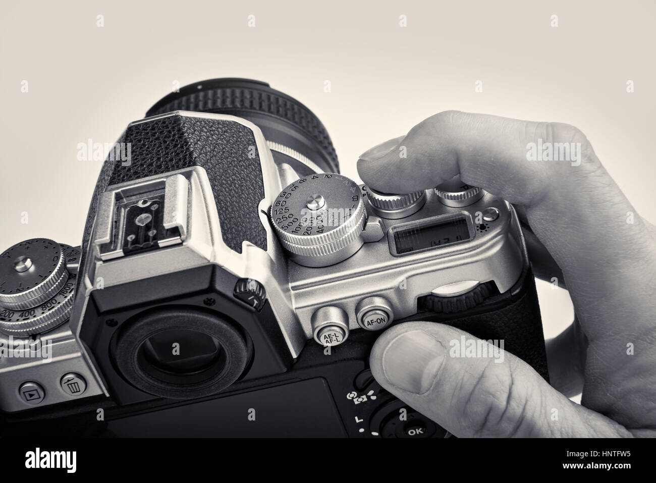 Retro SLR camera in the hands of the photographer close-up Stock Photo ...