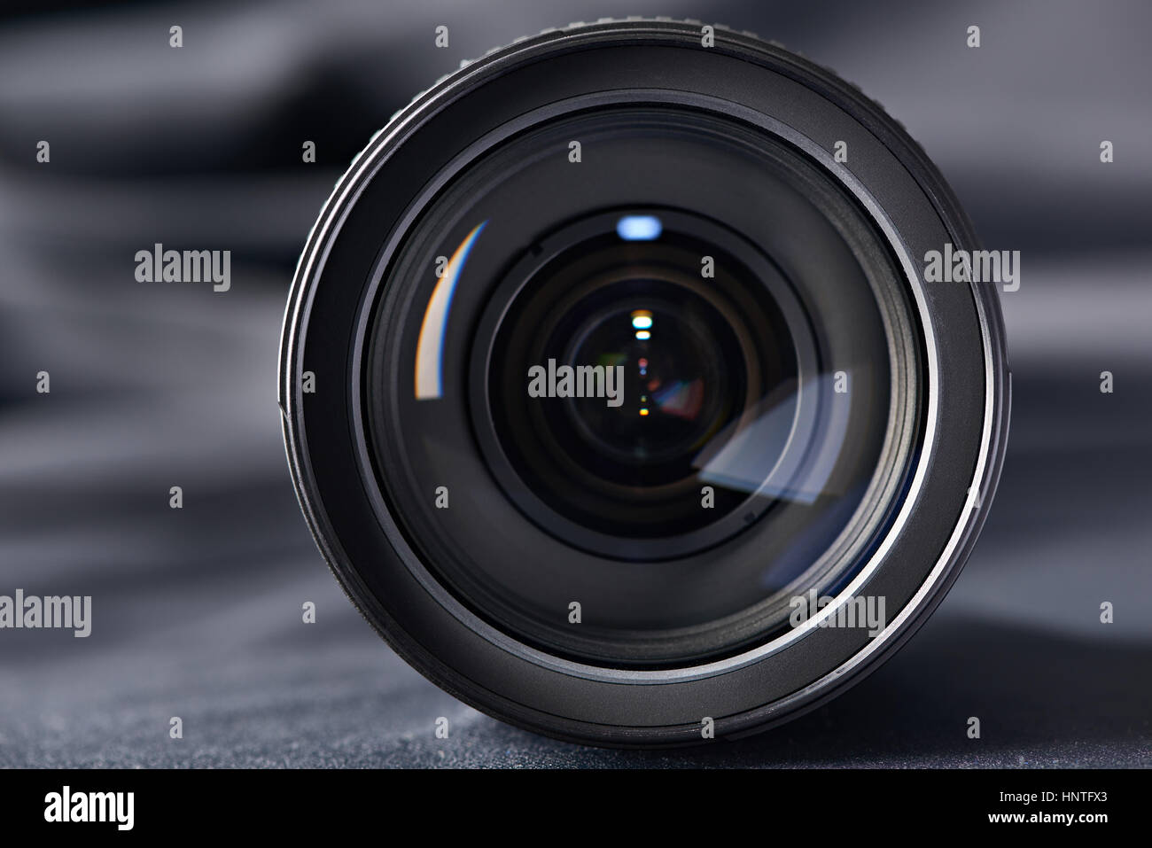 Photo lens front view on blurred background Stock Photo - Alamy