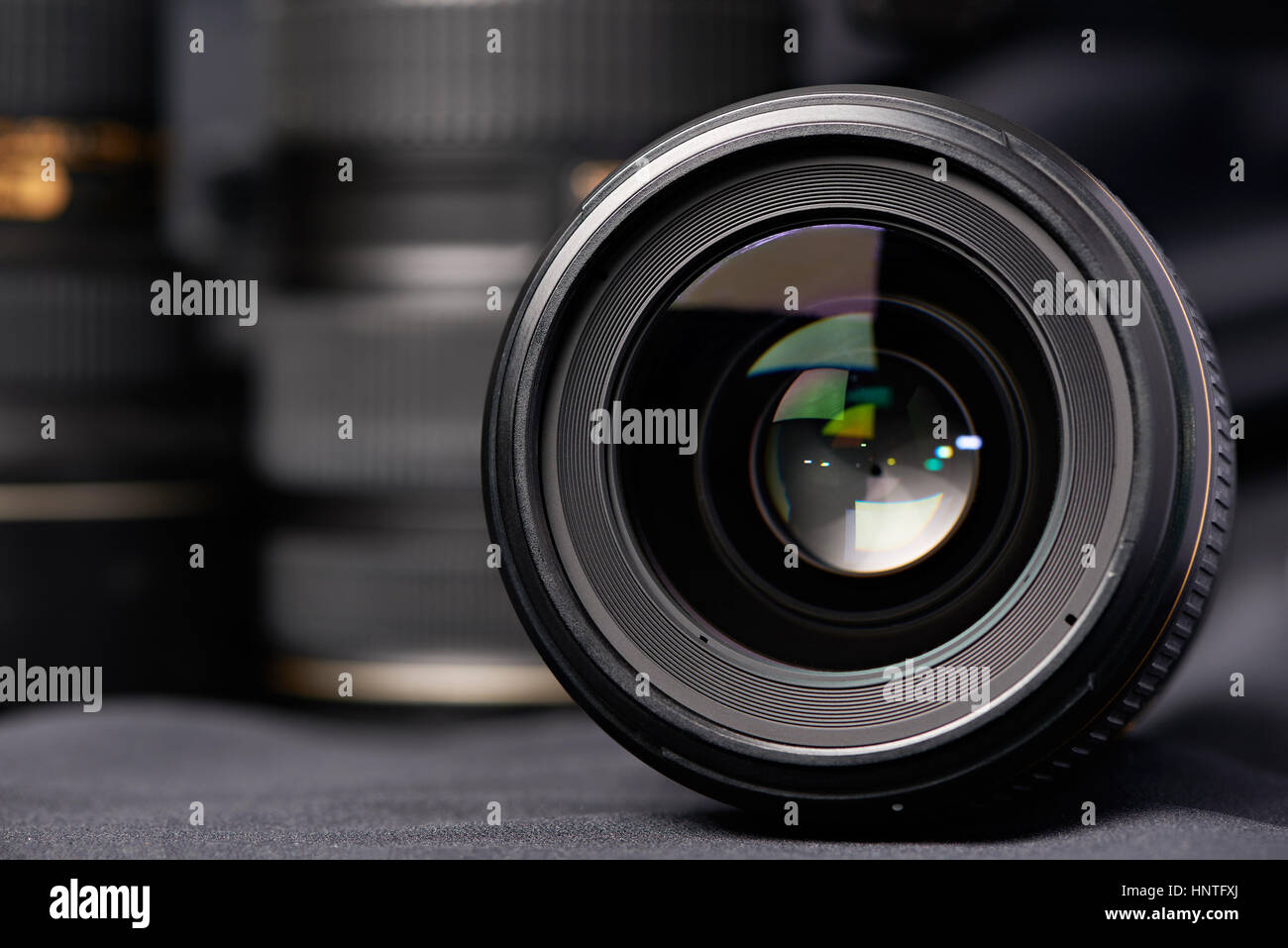 Photo lens front view on blurred background Stock Photo - Alamy