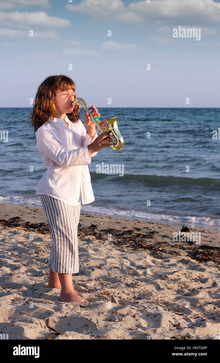 Beautiful girl saxophone hi-res stock photography and images - Alamy