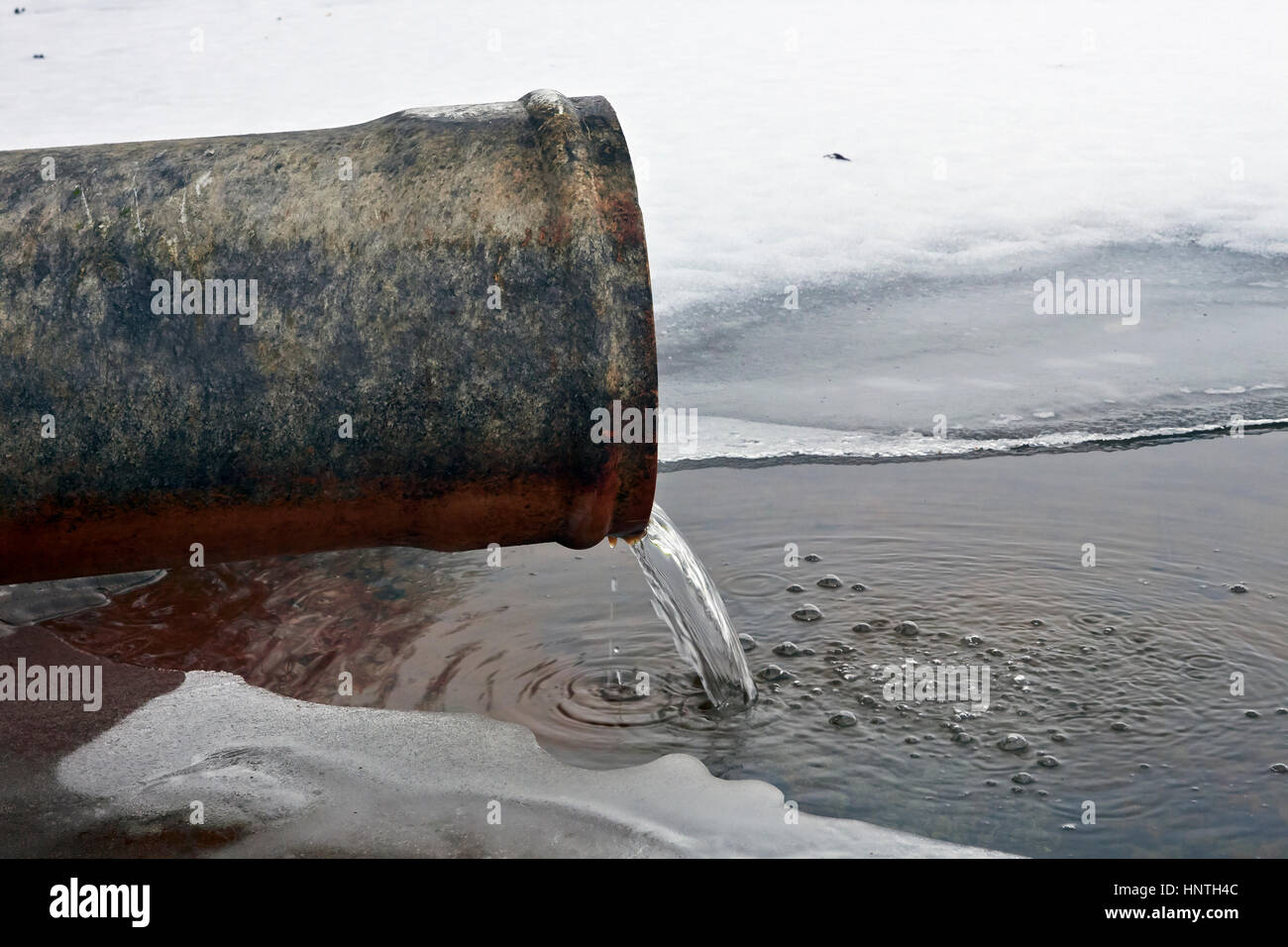 water running out of drain pipe into lake, Finland Stock Photo - Alamy
