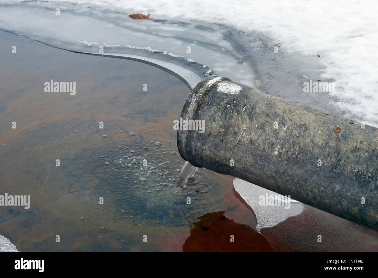 water running out of drain pipe into lake, Finland Stock Photo - Alamy