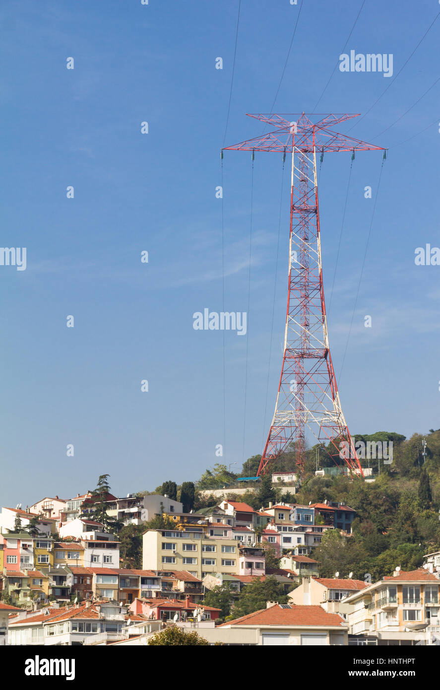 Huge pylon and power line above a residential area Stock Photo - Alamy