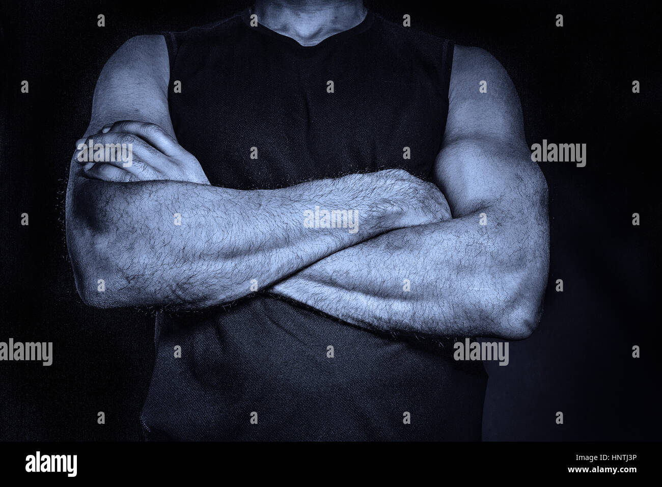 Man with folded arms Stock Photo - Alamy