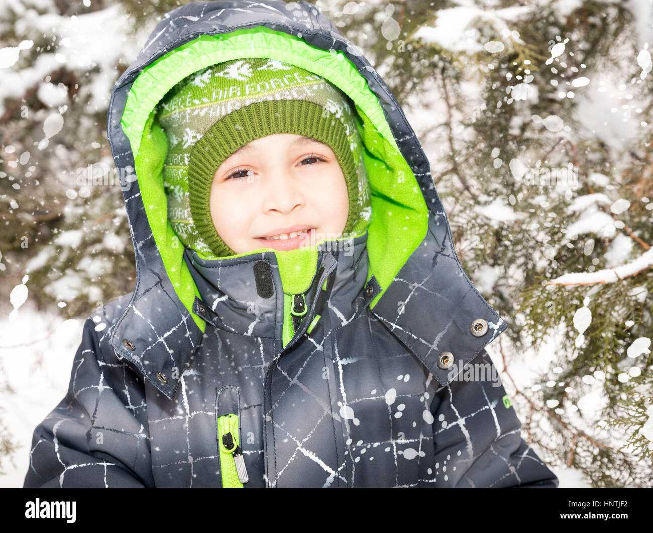 Close up portrait of adorable happy little boy grinning happily at the ...