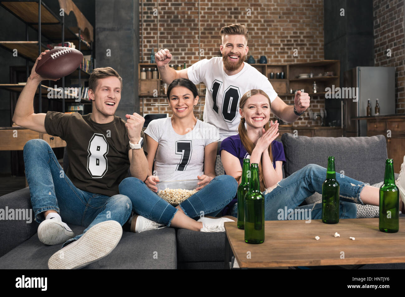 friends watching football match Stock Photo - Alamy