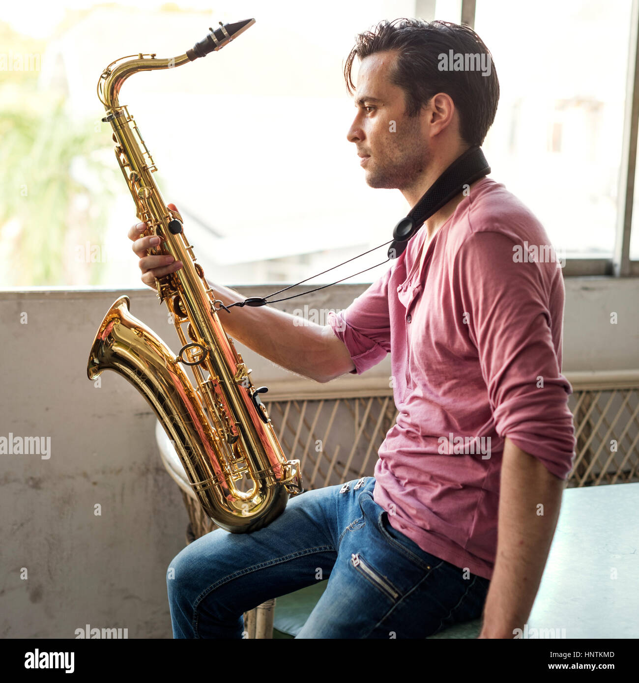 Casual saxophone hi-res stock photography and images - Alamy