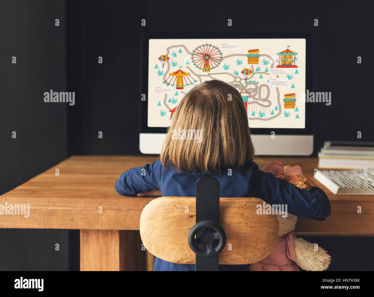 Little girl using computer hi-res stock photography and images - Alamy