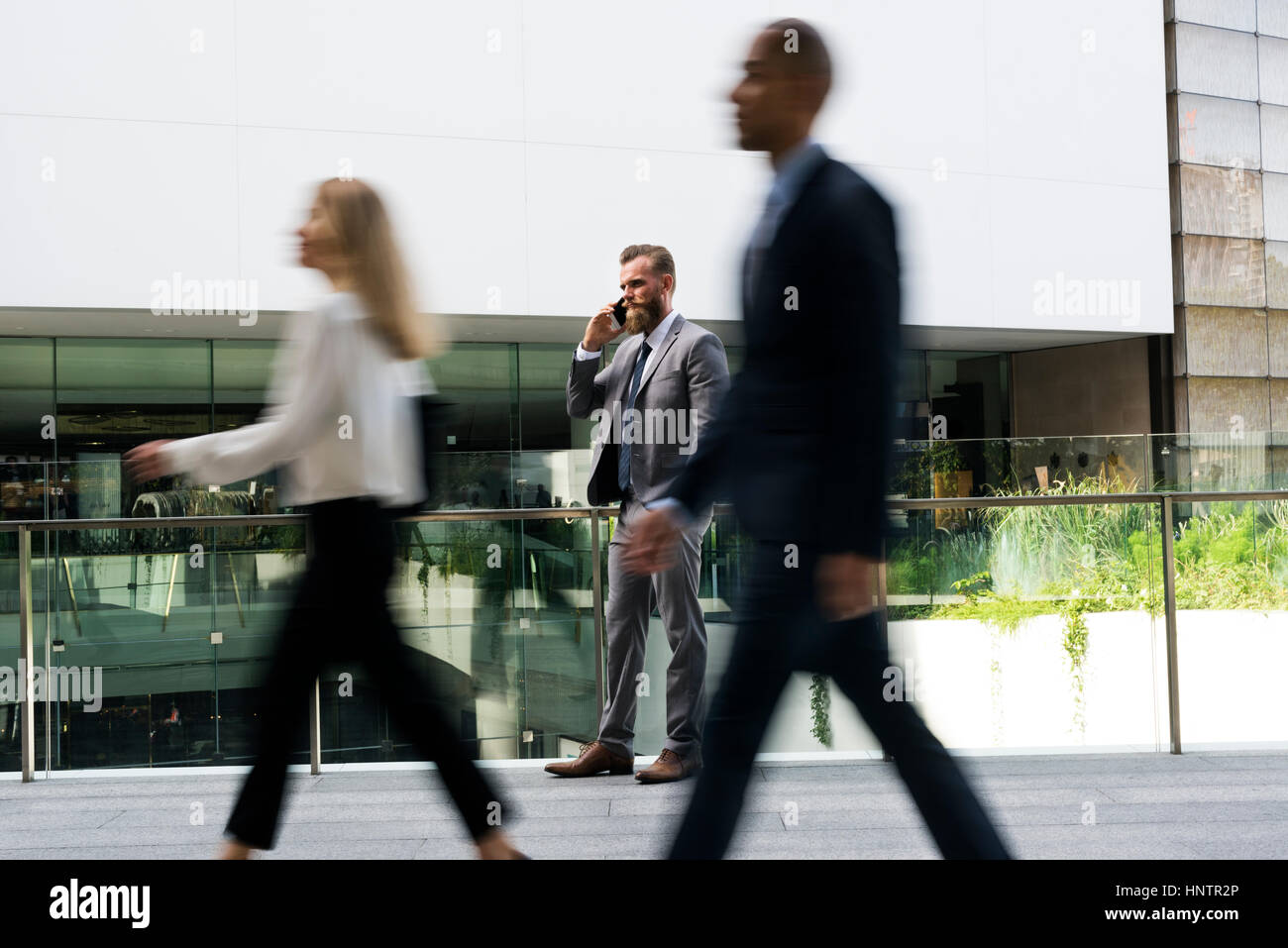 Businessmen Calling Phone People Walk Stock Photo - Alamy