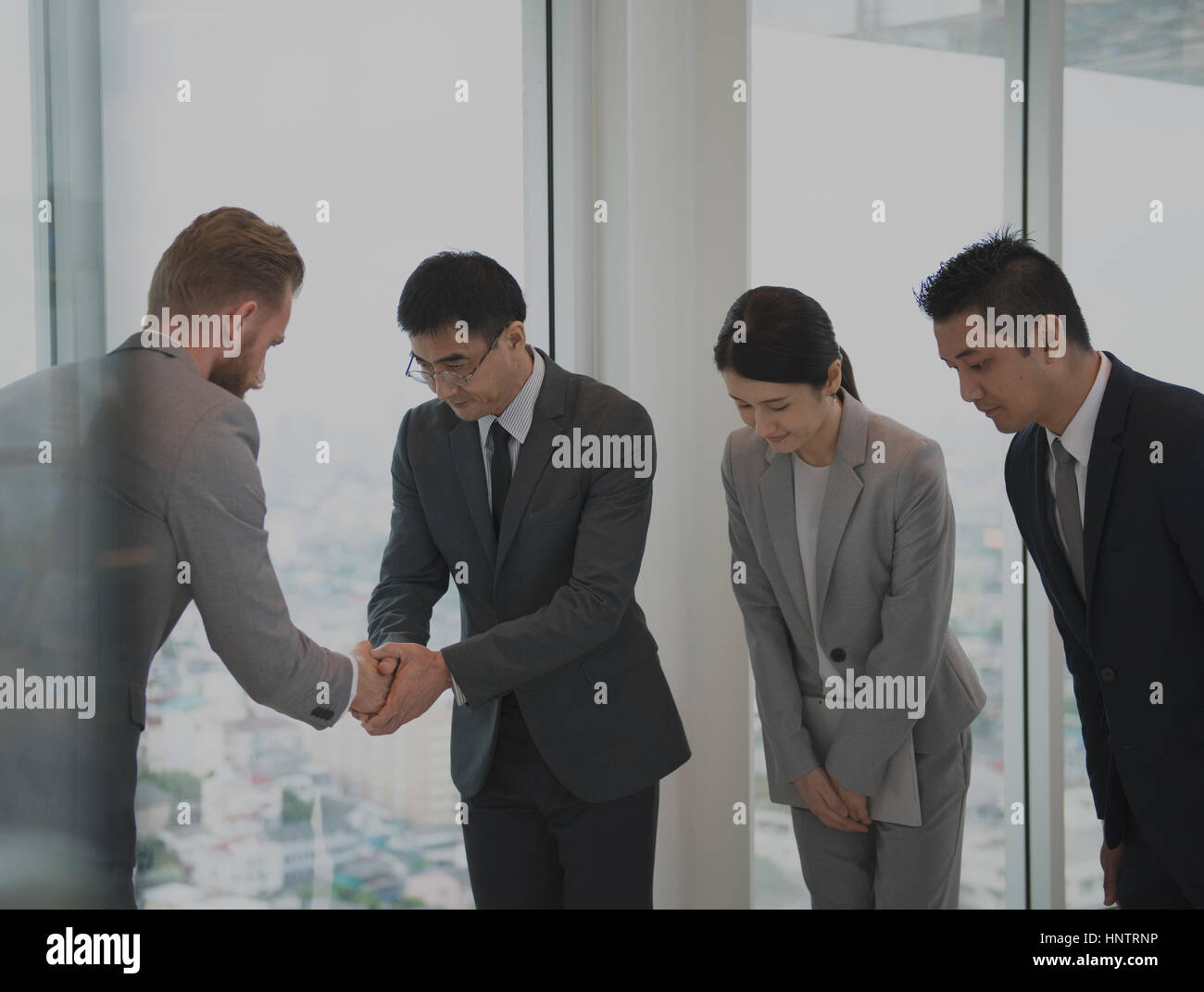 Business Partners Introductionary Handshake Bow Stock Photo - Alamy