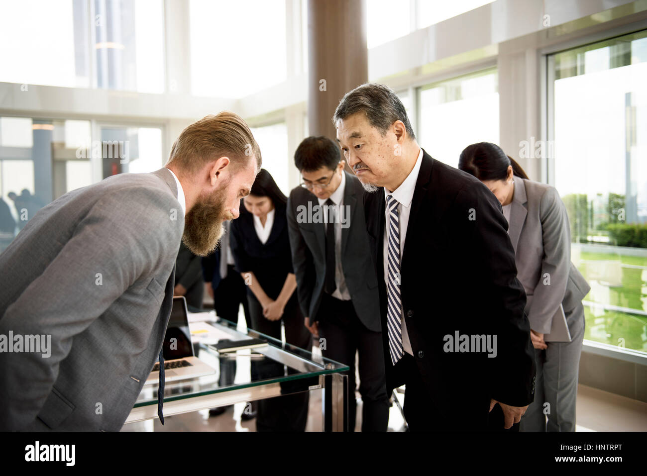 Business Partners Introductionary Handshake Bow Stock Photo - Alamy