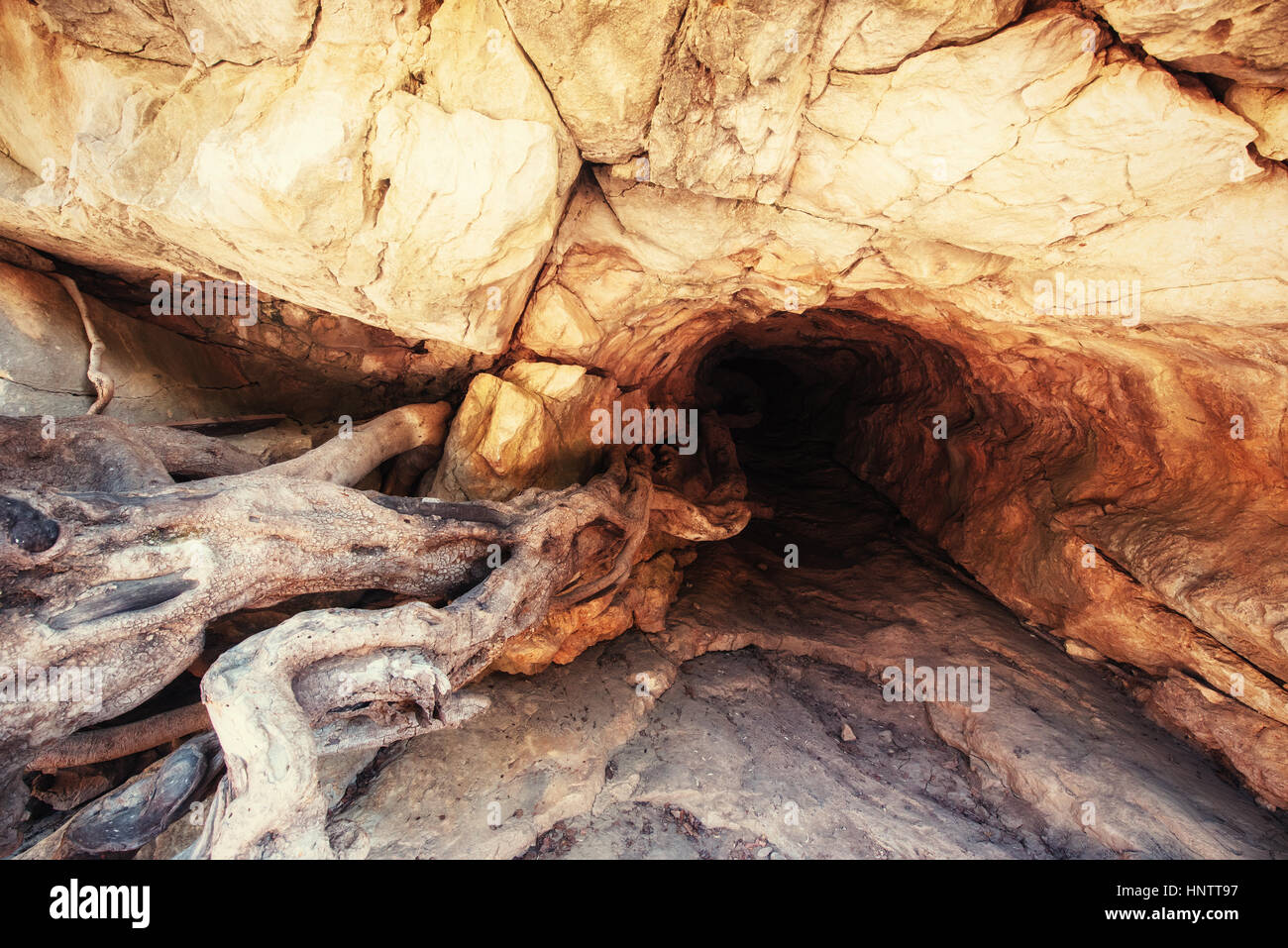 stone cave inside. view near the entrance Stock Photo - Alamy