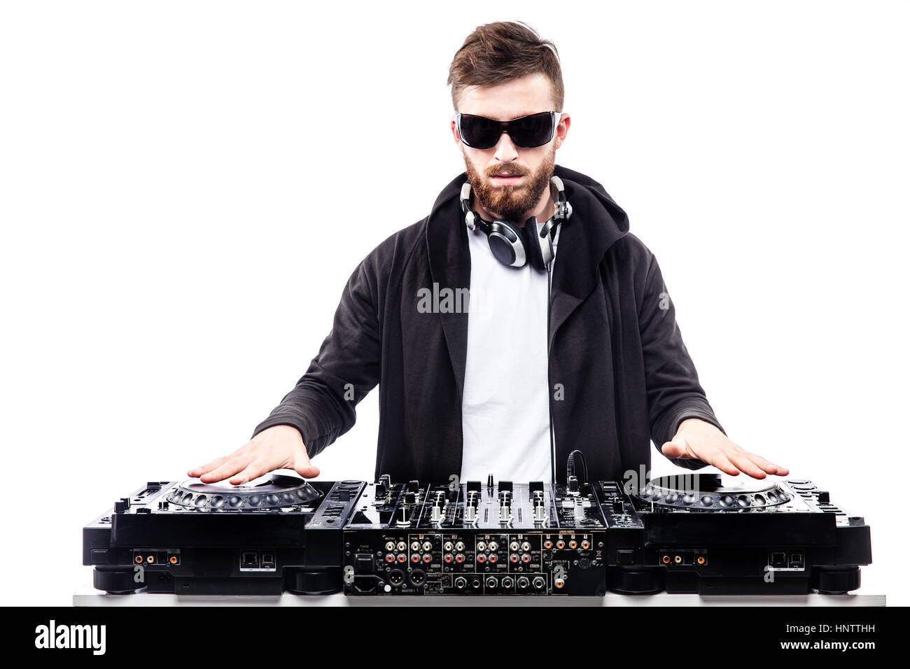 Trendy male dj posing against mixing console Stock Photo - Alamy