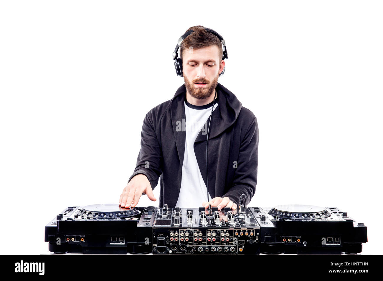 Trendy male dj posing against mixing console Stock Photo - Alamy