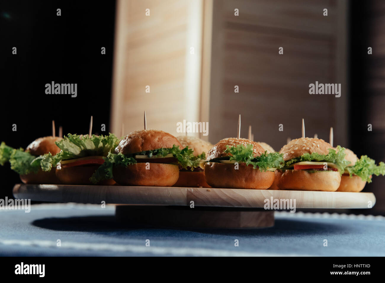 Hamburger on wood table. Home made burger. Fastfood meal Stock Photo ...