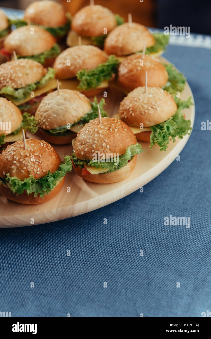 Hamburger on wood table. Home made burger. Fastfood meal Stock Photo ...