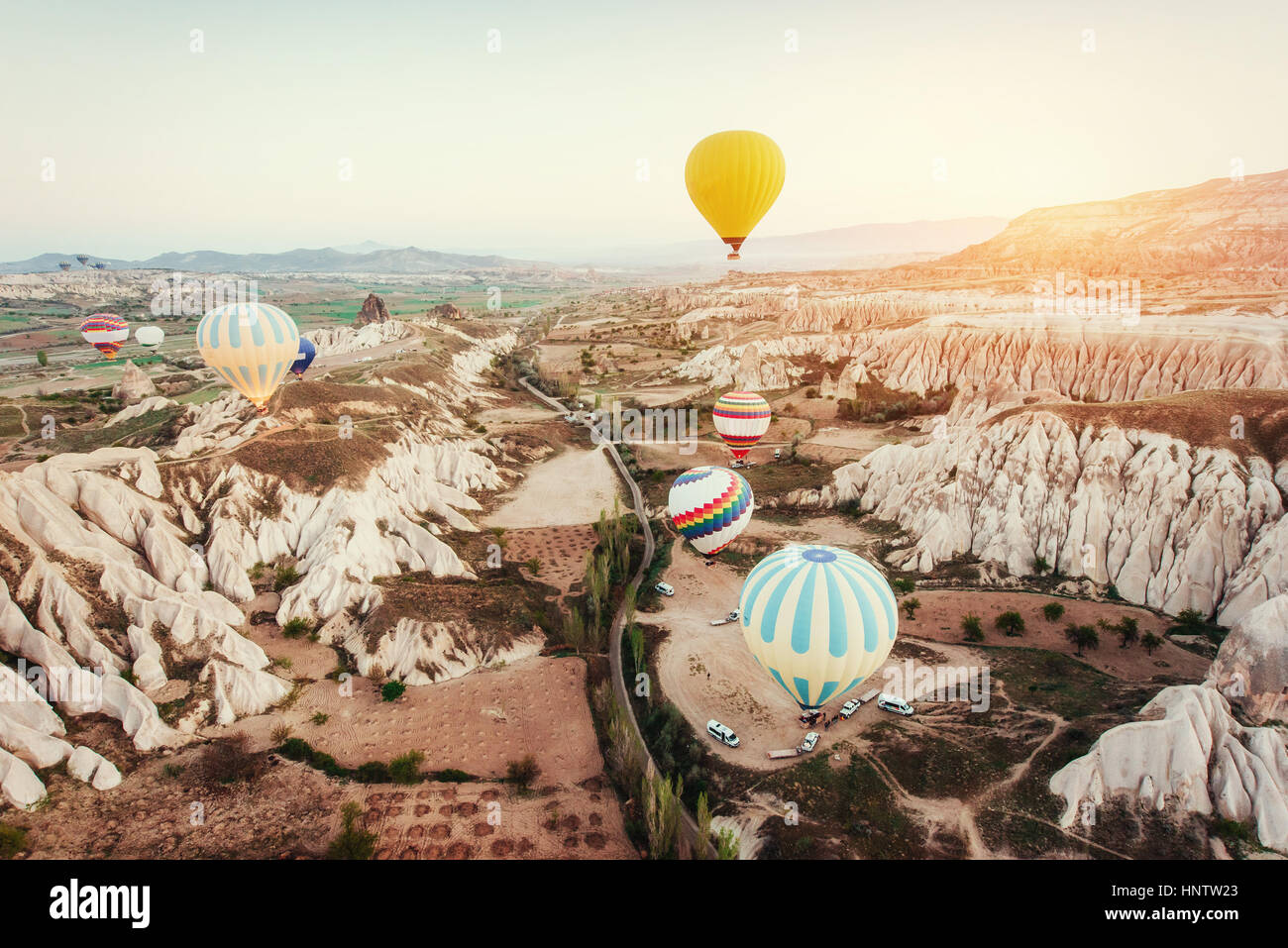 Colorful hot air balloons flying over Red valley at Cappadocia Stock ...