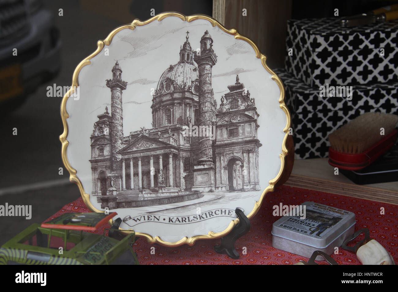 Souvenir plate of Karlskirche at Vienna in a junk shop window Stock ...