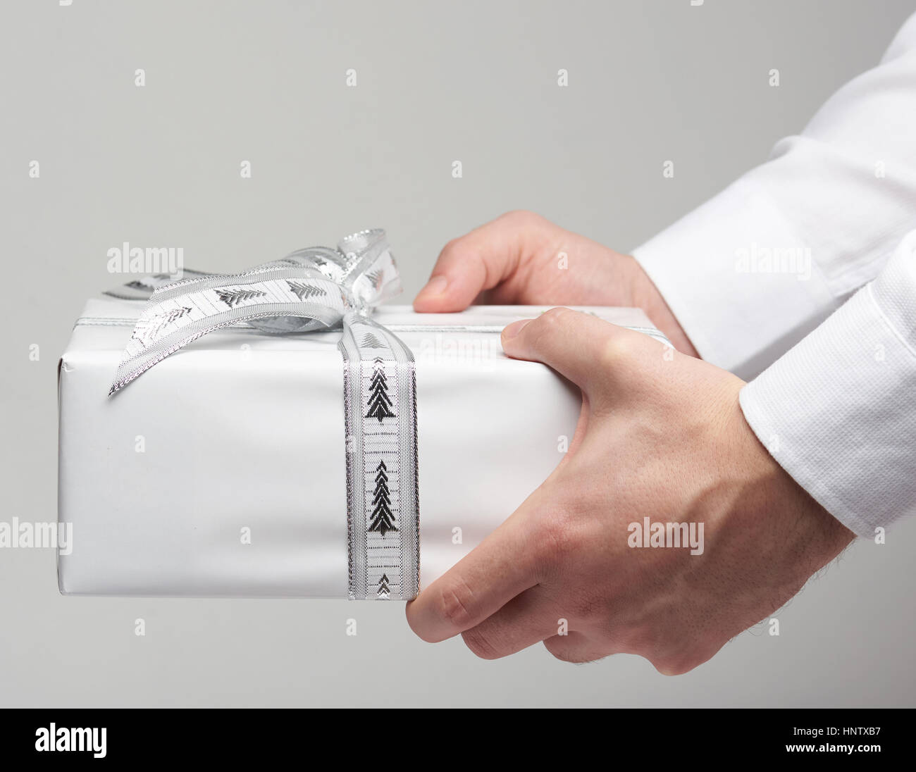 Gift white box in business office holding hands close up Stock Photo ...