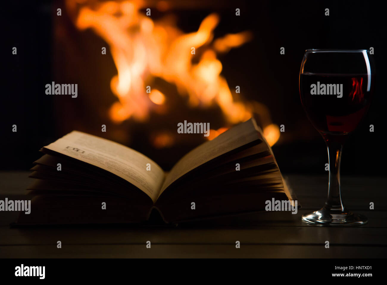 Glass wine book fireplace hi-res stock photography and images - Alamy