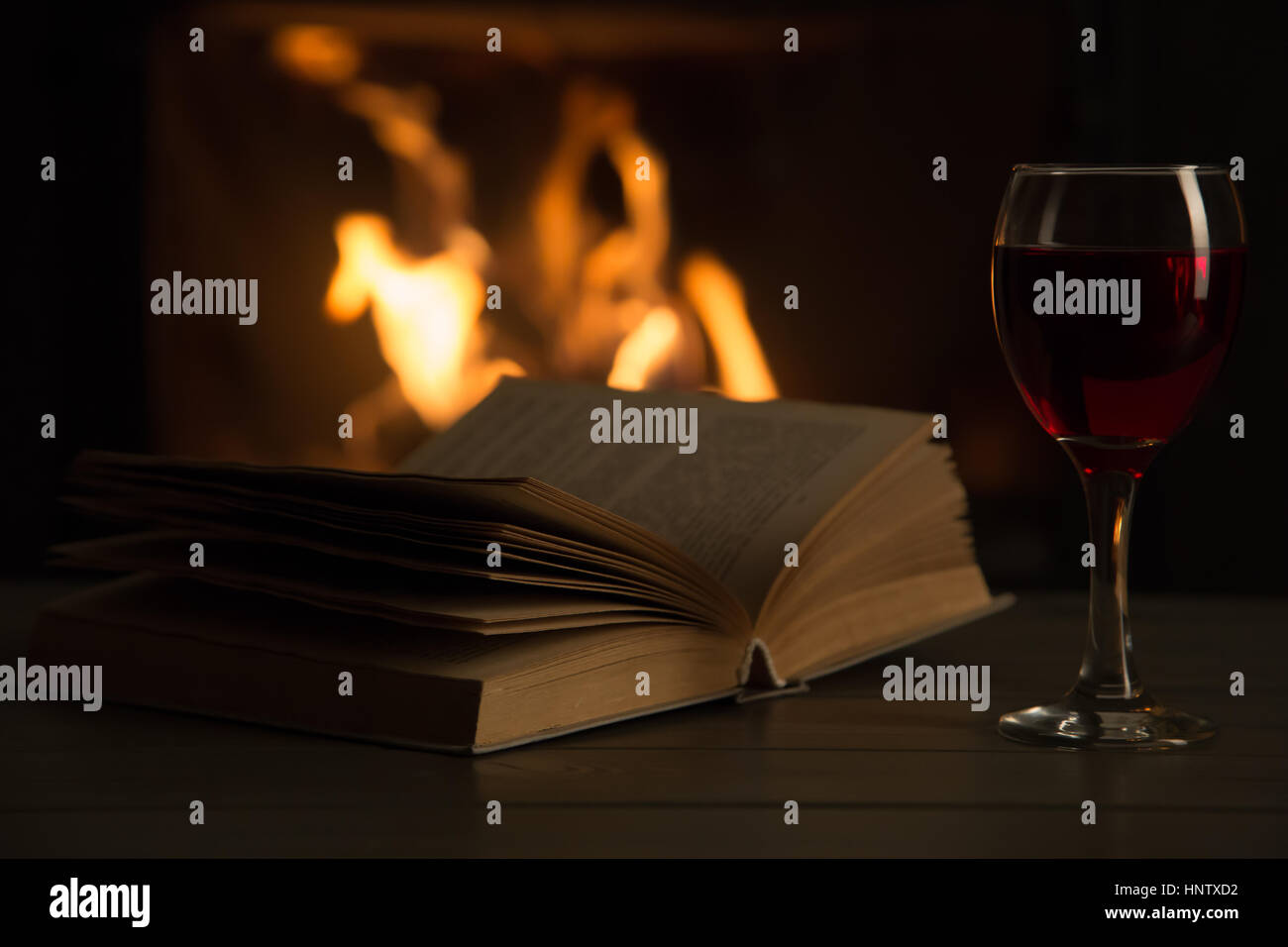 Glass wine book fireplace hi-res stock photography and images - Alamy