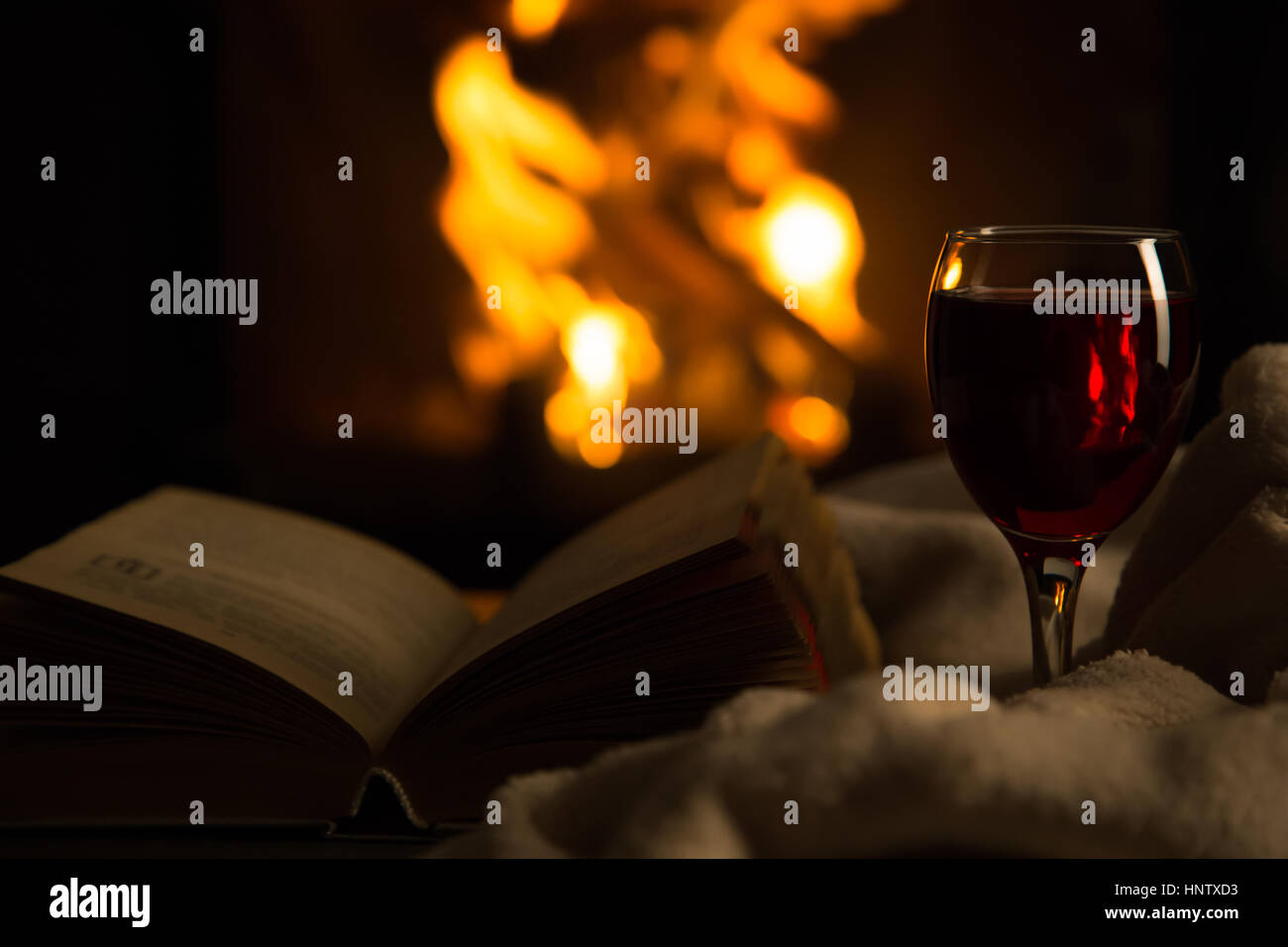 Glass wine book fireplace hi-res stock photography and images - Alamy
