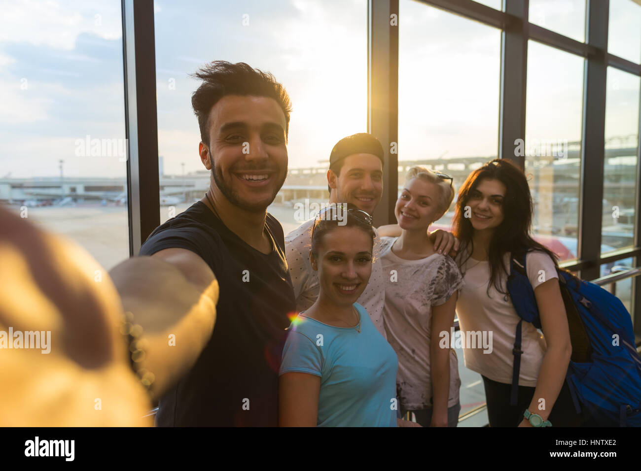 Young People Group In Airport Lounge Near Windows Happy Smile Mix Race ...