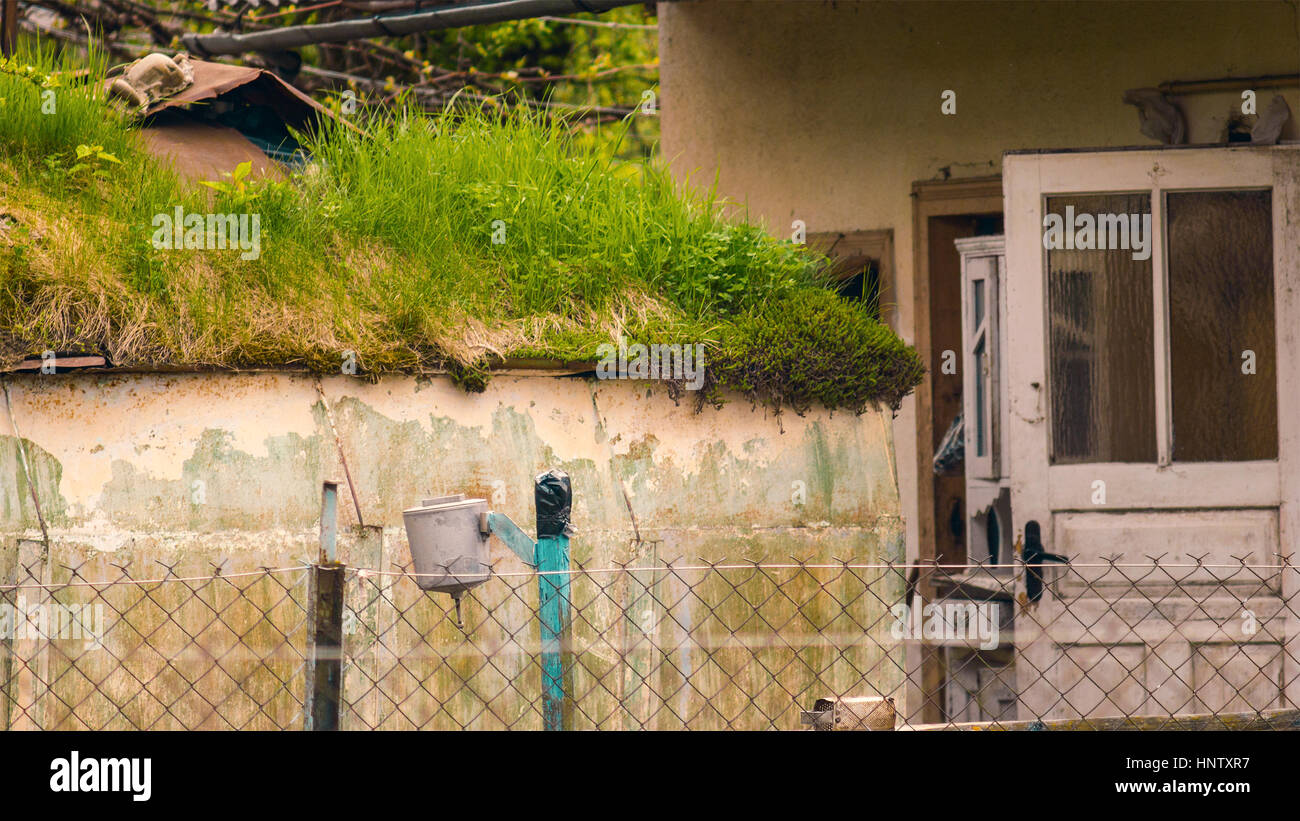 An old house below the ground level Stock Photo - Alamy