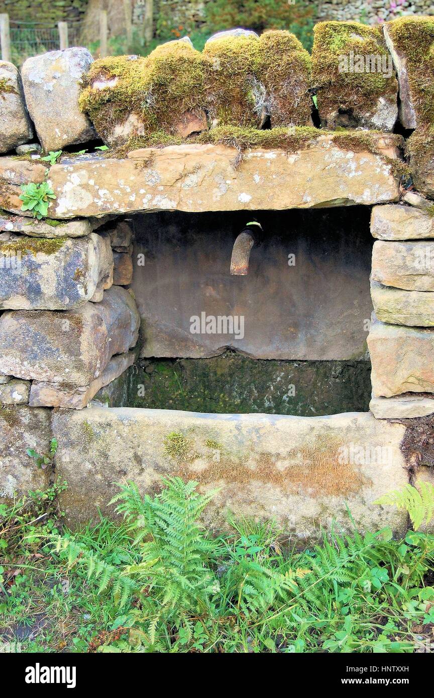 Water trough for sheep on a hill farm in the Peak District National ...