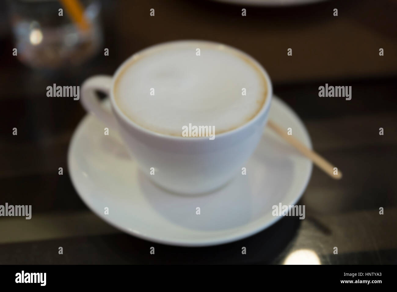 cup of hot frothy latte coffee with bokeh light, blur background Stock ...