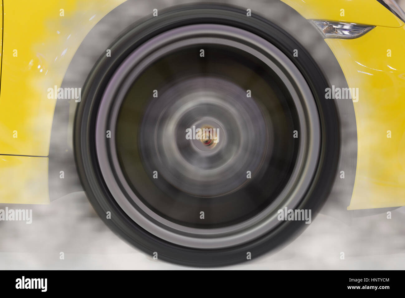 drifting wheel of new yellow sport car Stock Photo - Alamy