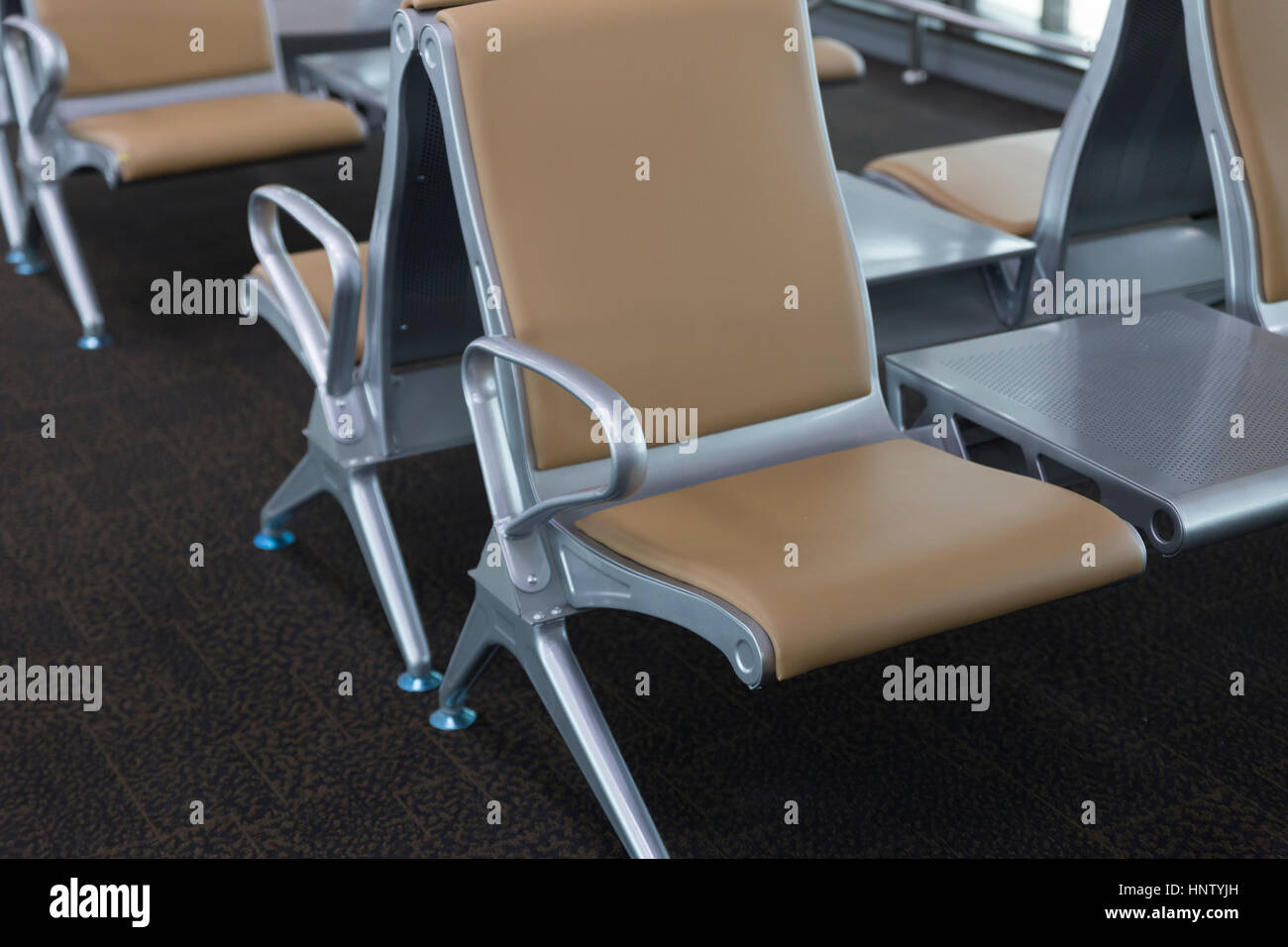 brown leather chair in airport terminal building Stock Photo - Alamy