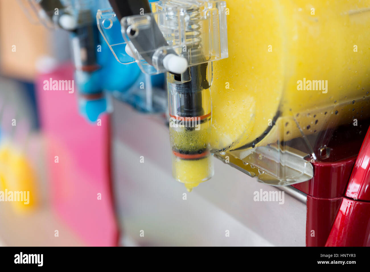 cold ice slush fruit juice beverage equipment machine, selective focus ...
