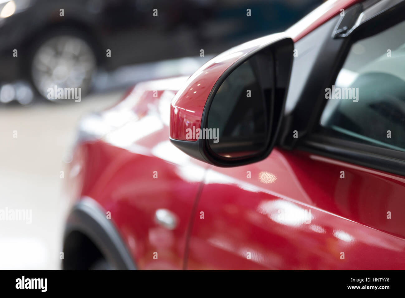rear side mirror of new red car, selective focus Stock Photo - Alamy