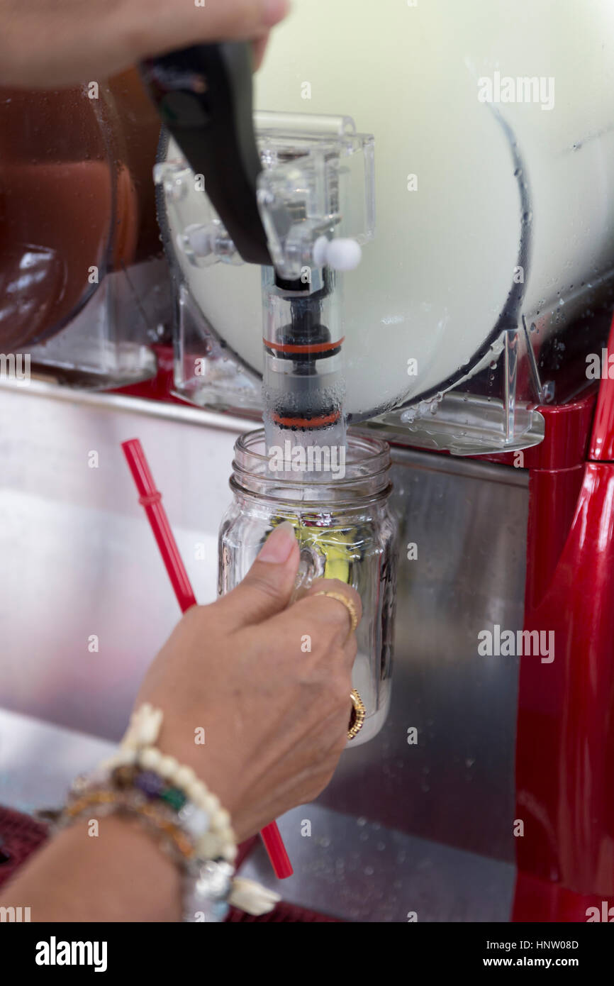 hand pulling cold ice slush fruit juice beverage equipment machine ...