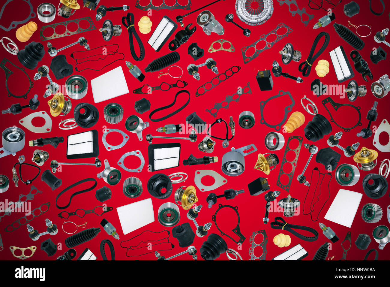 Spare parts car on the red background Stock Photo - Alamy