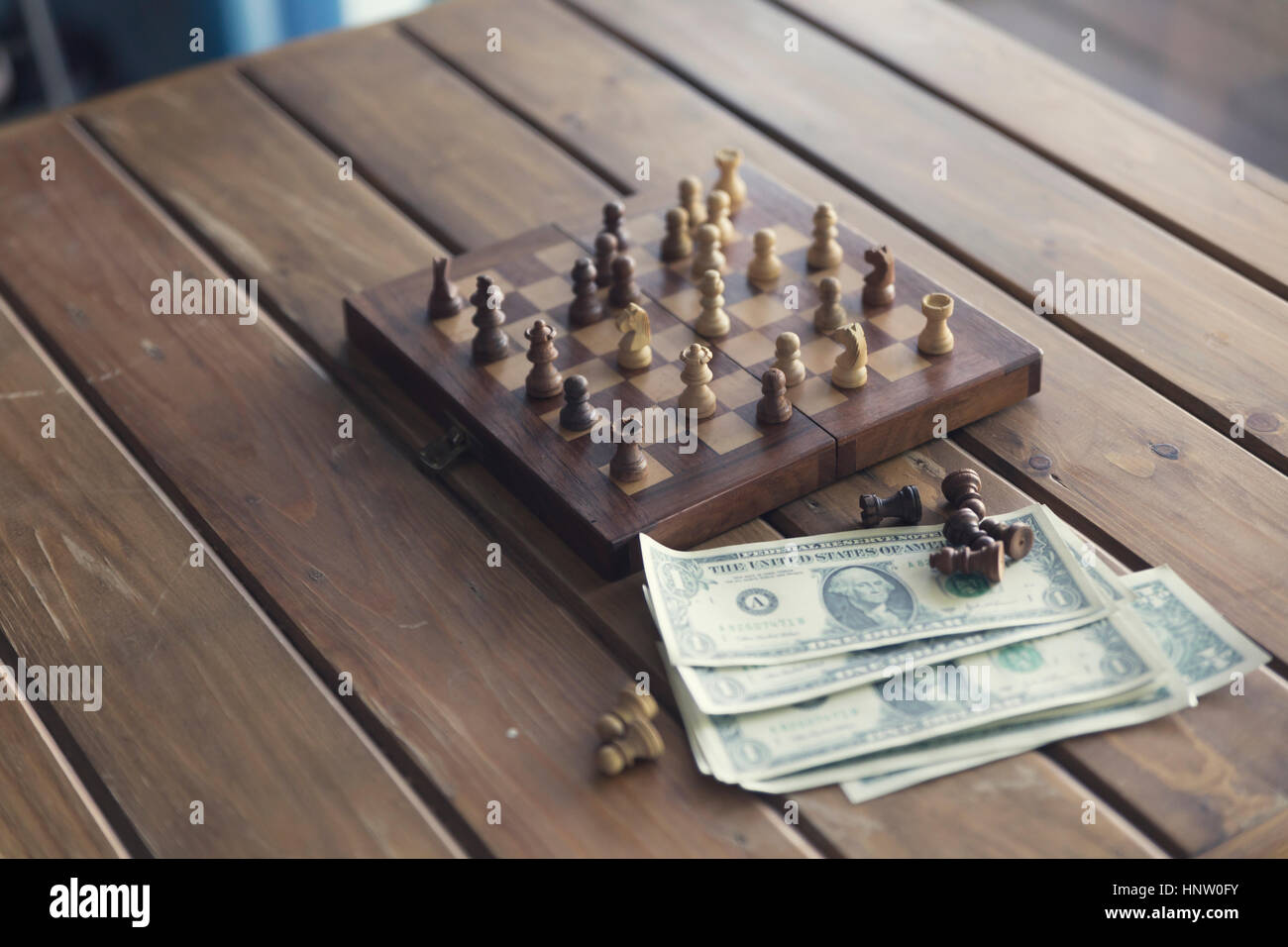 pawn of chess game and money banknote on wooden table for use in ...