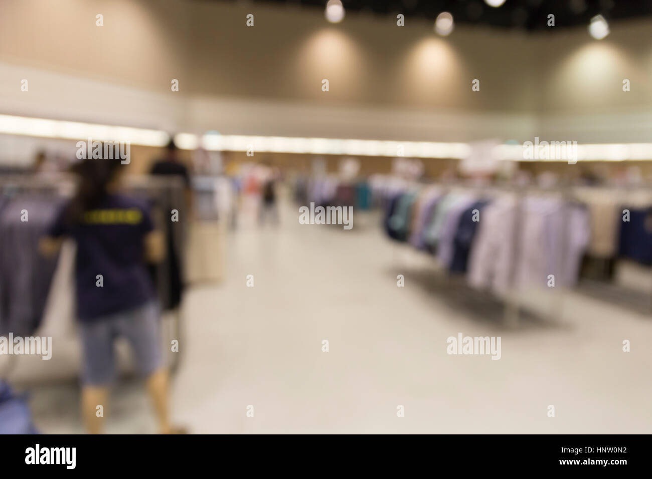 clothing selling in department store for use as shopping concept, blur ...
