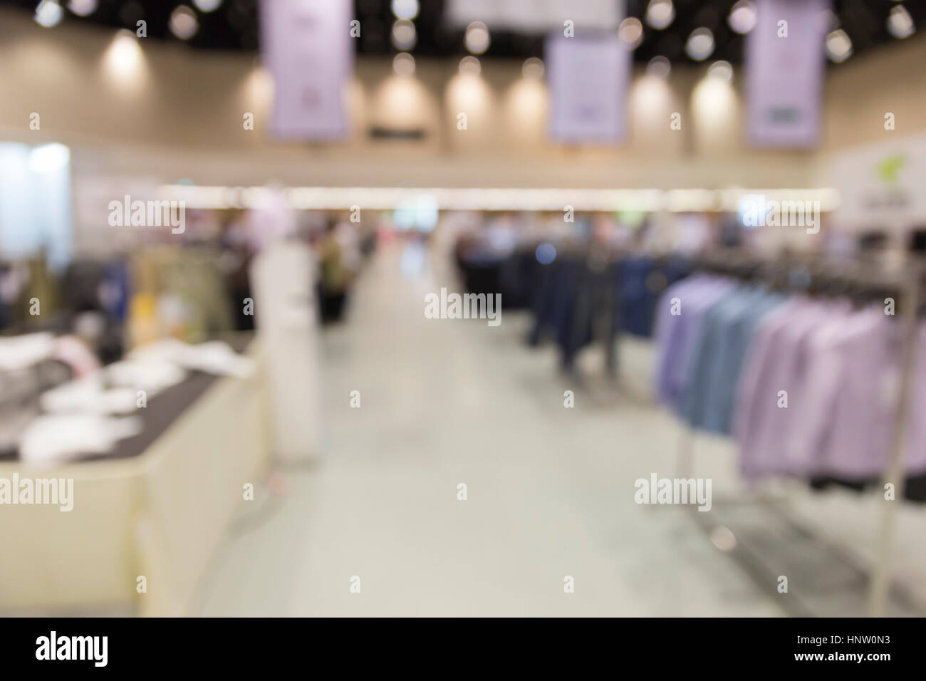 clothing selling in department store for use as shopping concept, blur ...