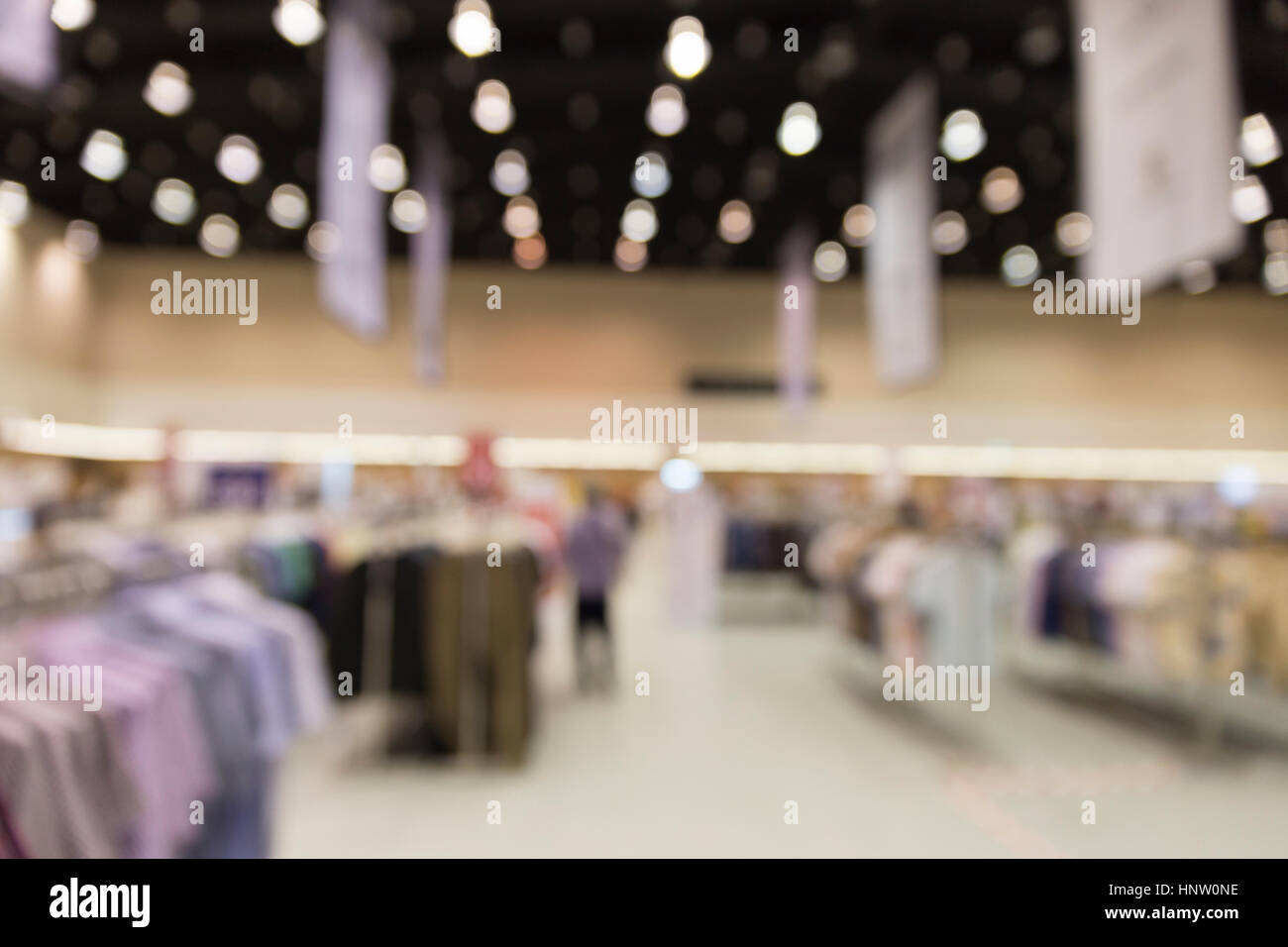 clothing selling in department store for use as shopping concept, blur ...
